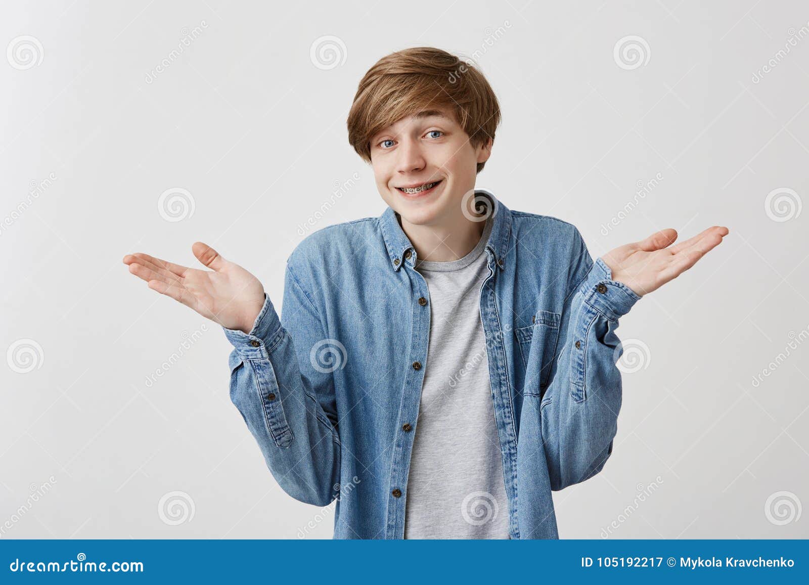 Caucasian Young Male Has Hesitant and Excusing Face Expression ...