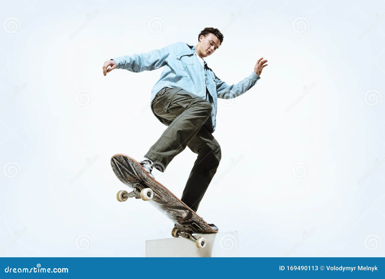 Caucasian Young Skateboarder Riding Isolated on a White Background ... Caucasian Young Skateboarder Riding Isolated on a White Background ...