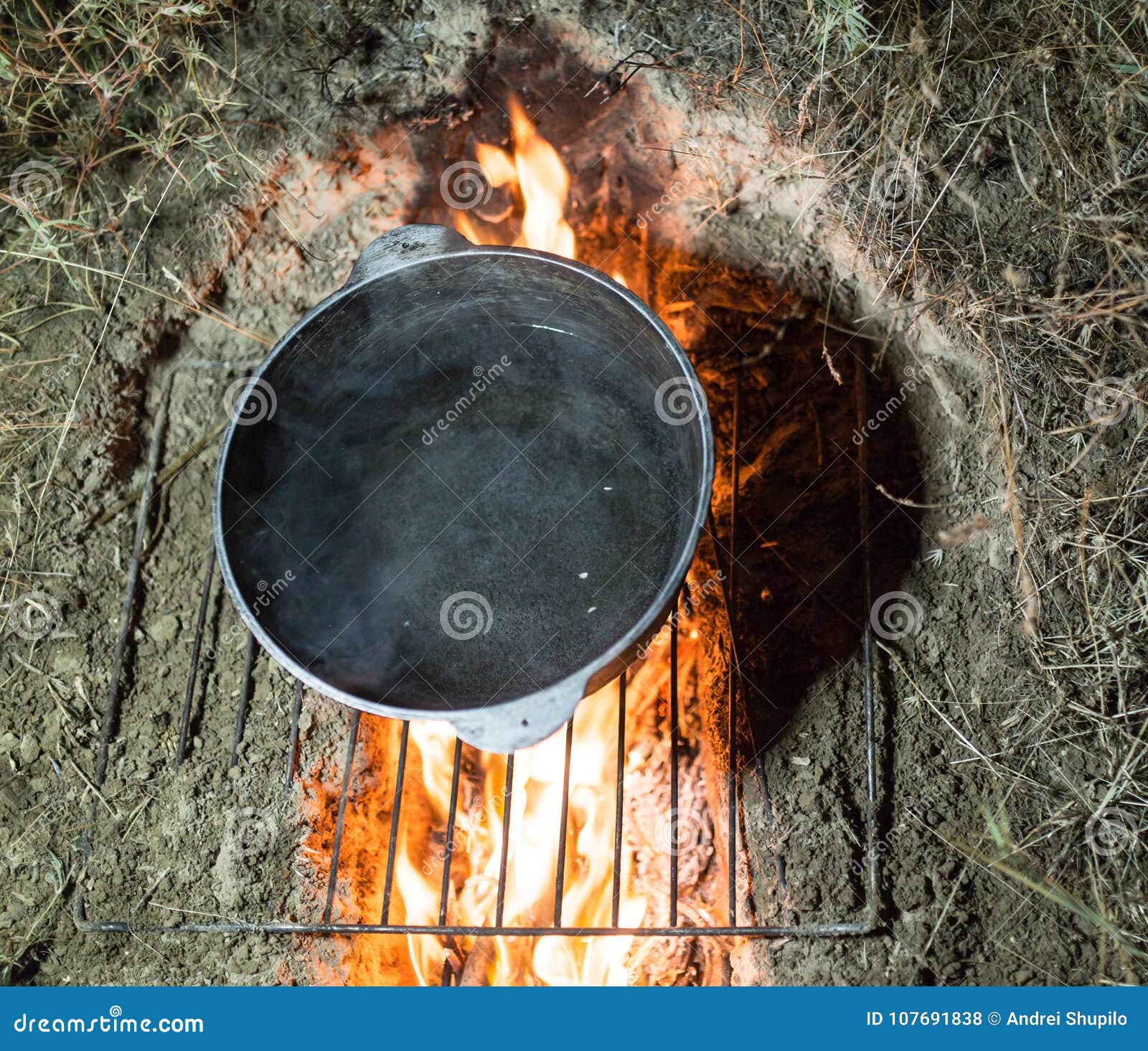 Cauldron on fire at night stock photo. Image of summer - 107691838