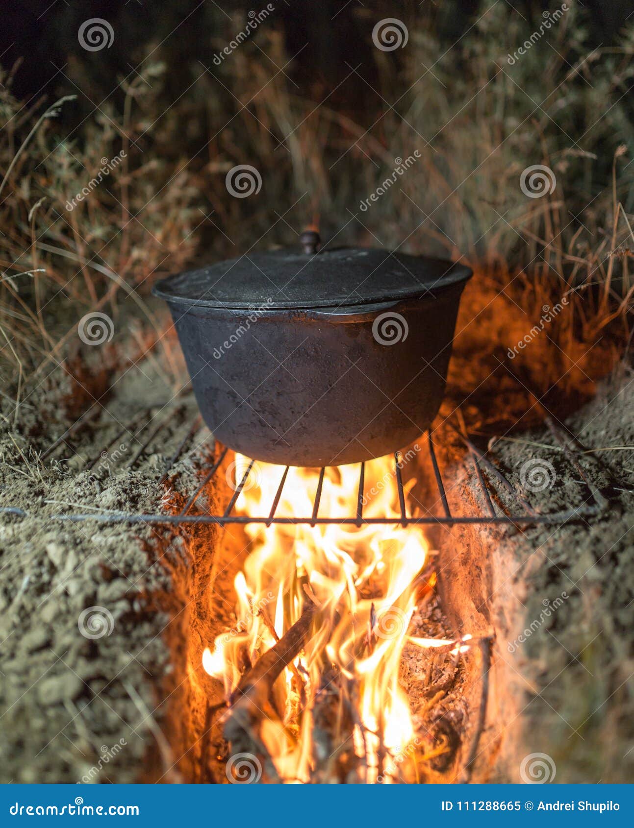 Cauldron on fire at night stock image. Image of outdoor - 111288665
