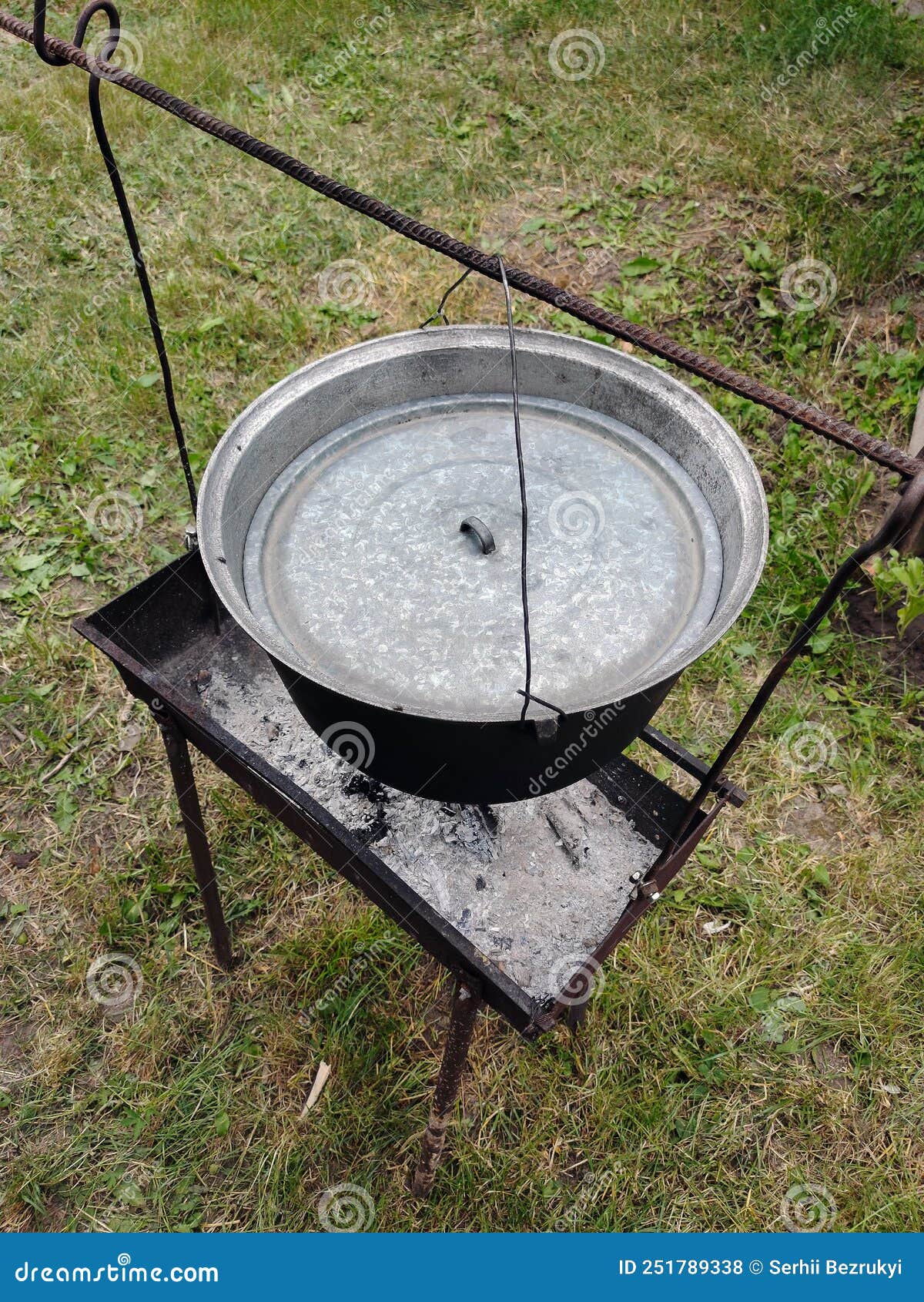 A Cauldron with a Lid Hangs on the Grill with Coal Stock Photo - Image ...
