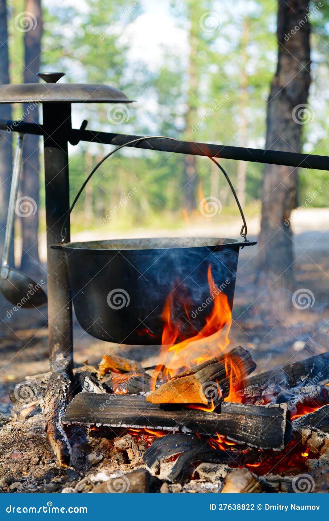 Cauldron over campfire stock photo. Image of firewood - 27638822