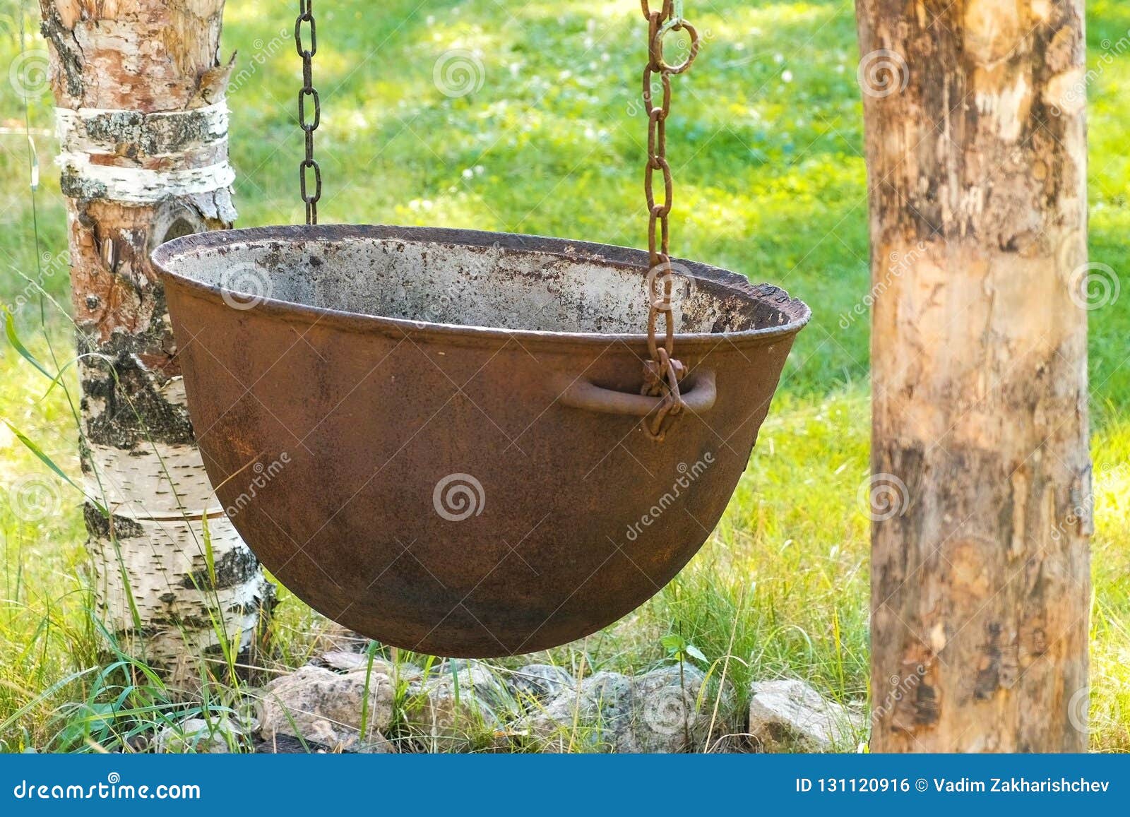 Cauldron, Pot for Cooking Hanging on Chains Over the Fire. Stock Photo ...