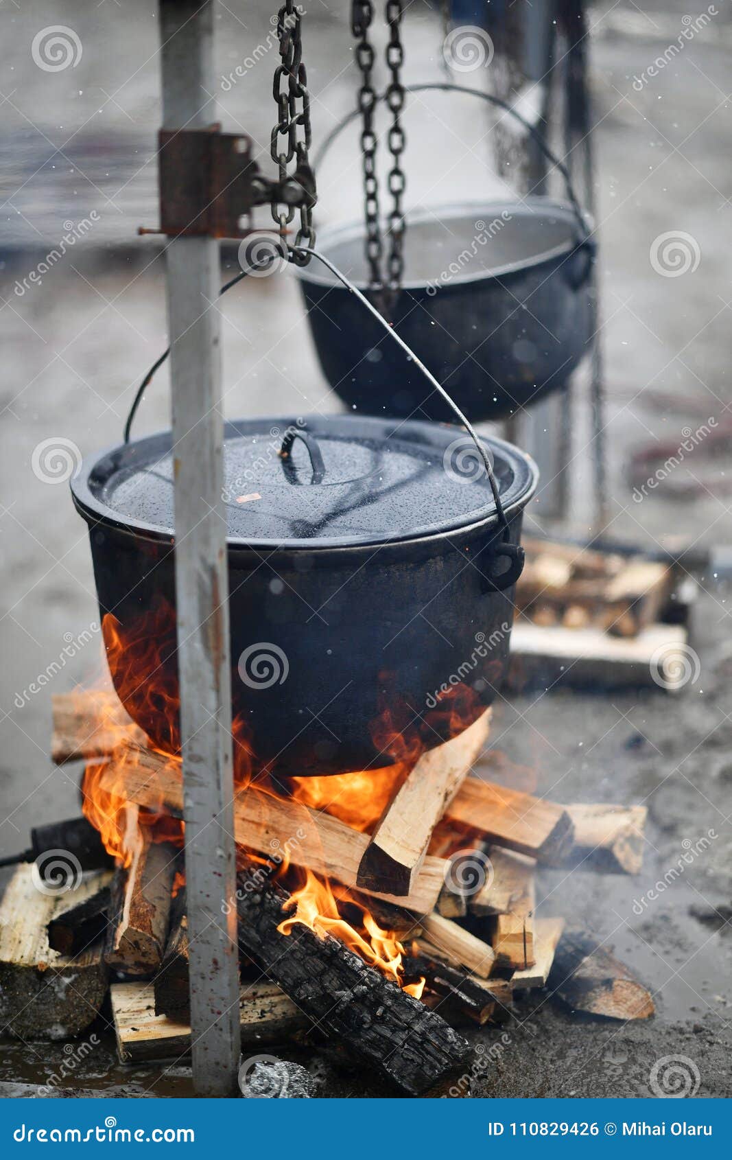 Cauldrons over the fire stock photo. Image of outdoorn - 110829426