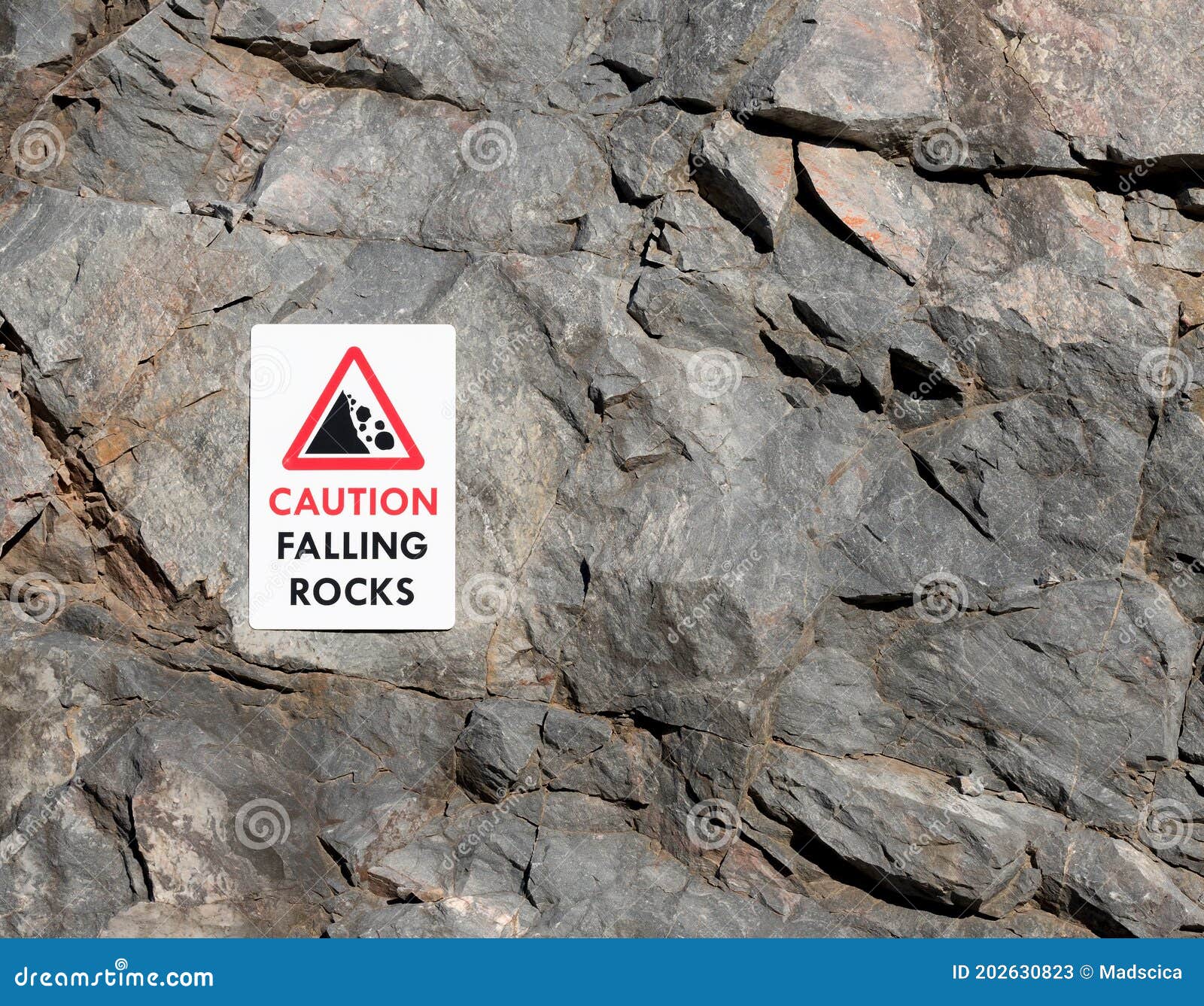 CAUTION FALLING ROCKS sign stock image. Image of stone - 202630823