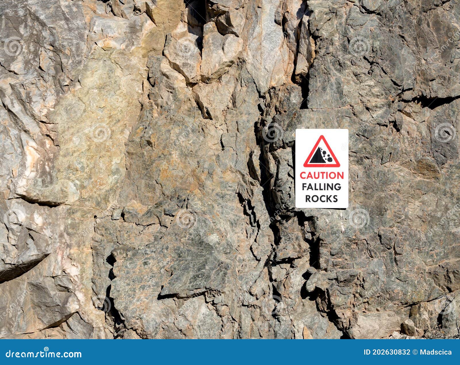 CAUTION FALLING ROCKS sign stock photo. Image of hazard - 202630832