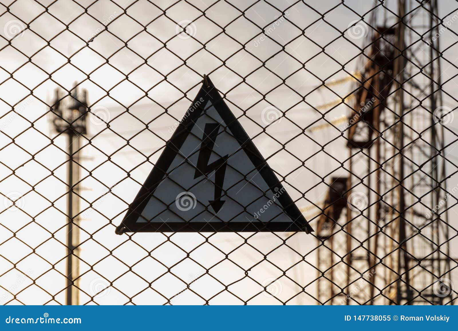 Caution High Voltage. A Triangular Sign With A Lightning Bolt Hanging ...