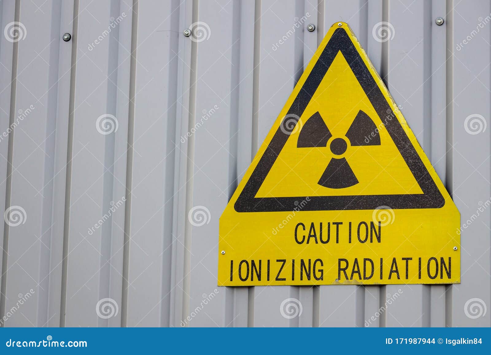 Caution Ionizing Radiation Sign on the Wall Stock Photo - Image of ...