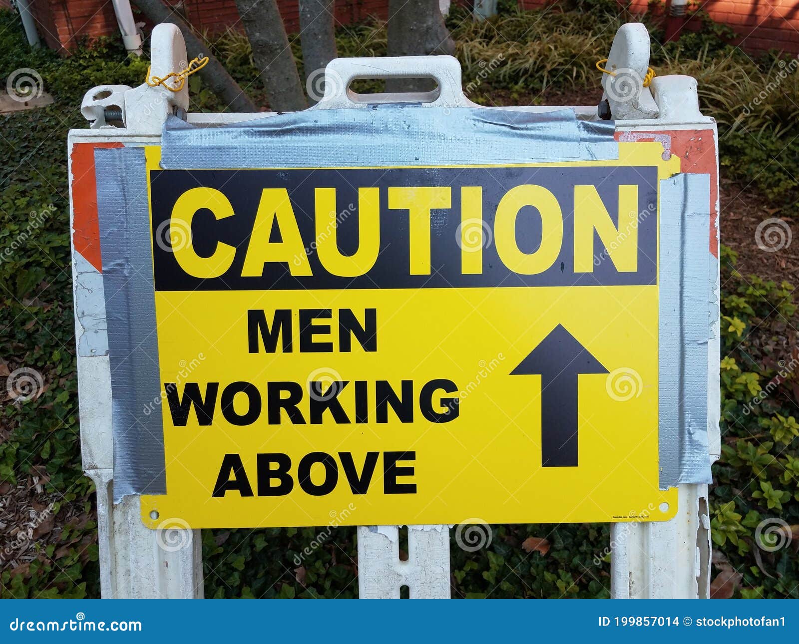 Caution Men Working Above Sign with Arrow Stock Photo - Image of ...