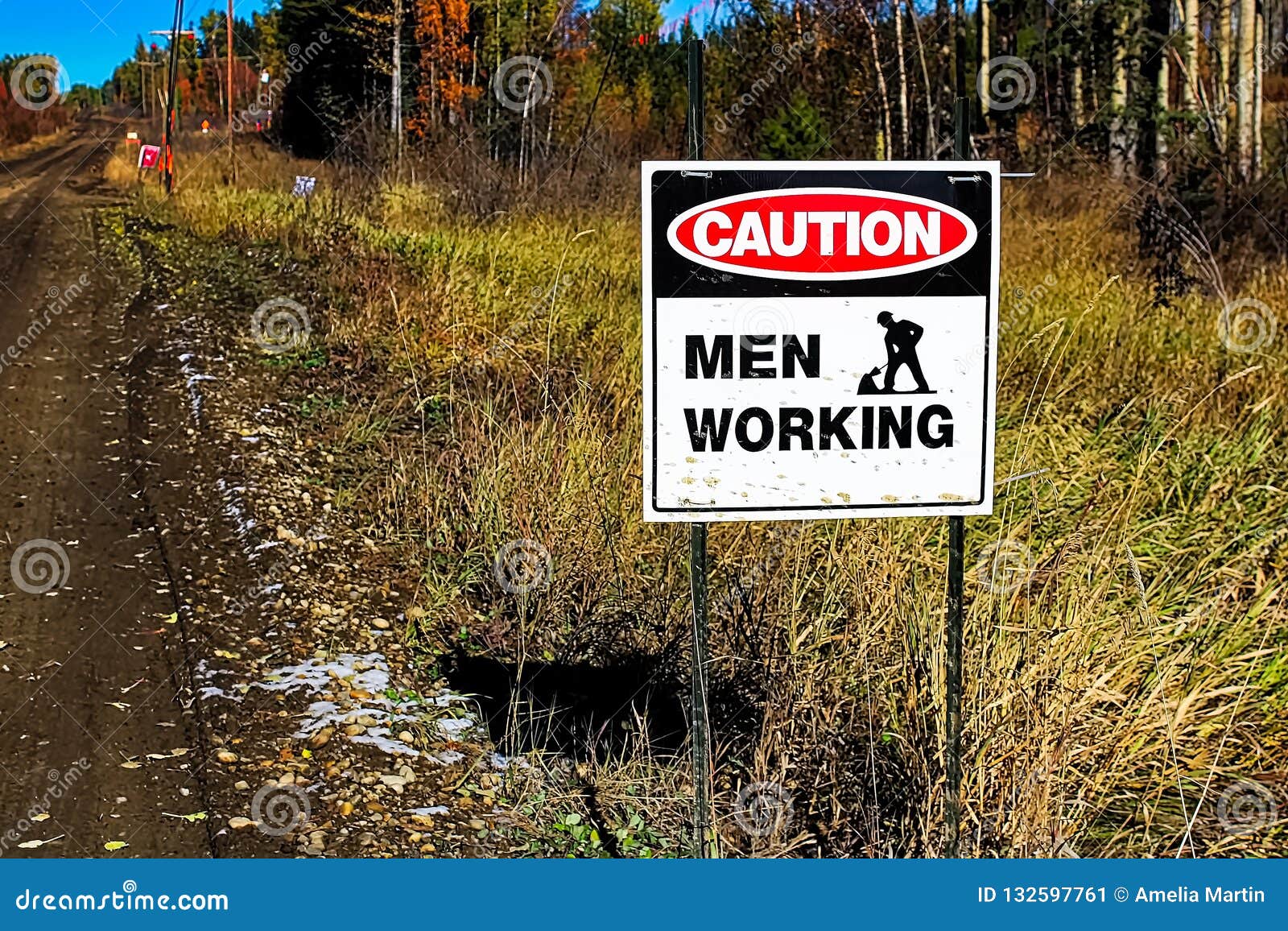 A Caution Men Working Sign beside a Road Stock Image - Image of area ...