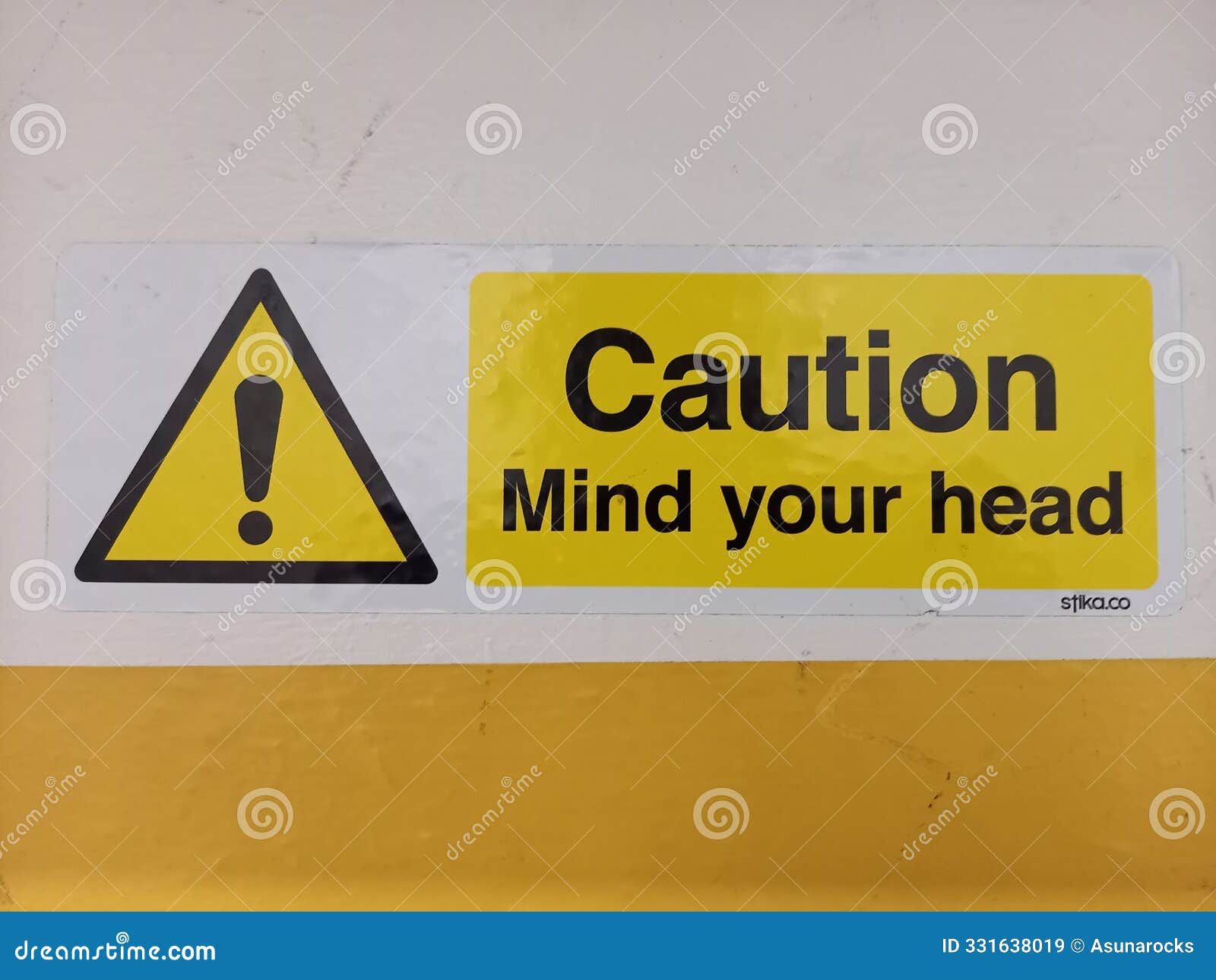 Caution Mind Your Head Warning Sign on White and Yellow Background ...