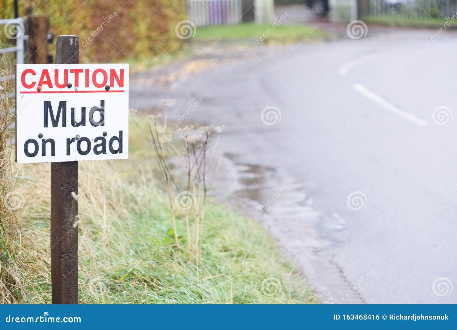 Caution Mud on Road Sign at Bend Stock Photo - Image of slow, lane ...