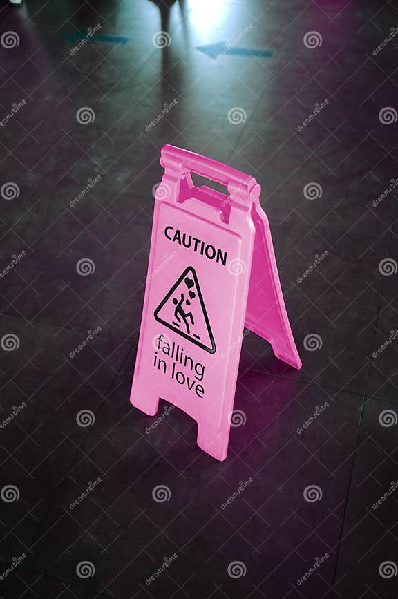 Caution Pink Sign for Warning, Falling in Love, on a Floor Stock Photo ...