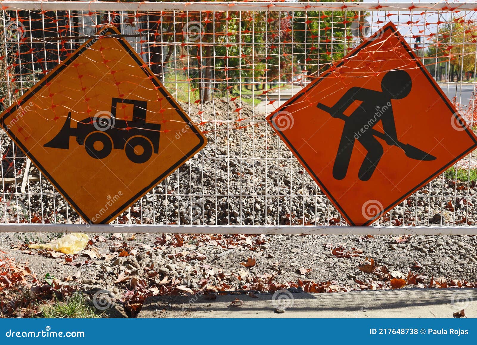 Caution Signal of Men Working and Construction Machinery on the ...