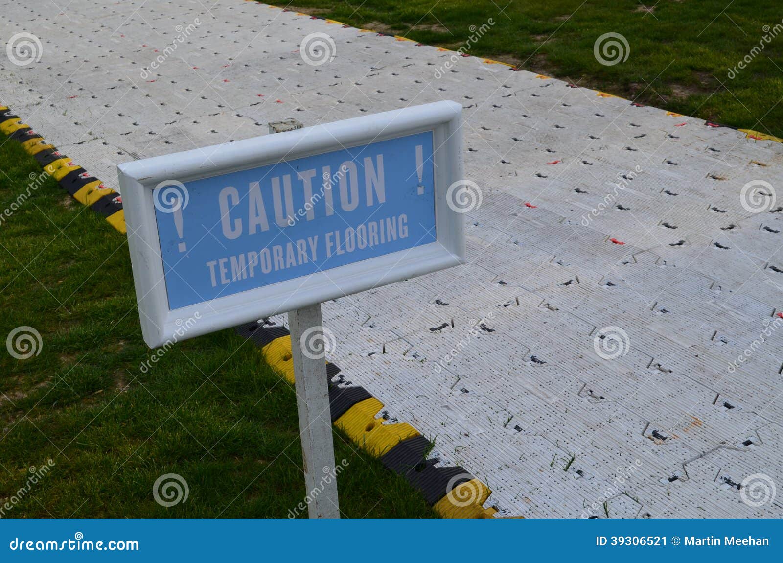 Caution Temporary Flooring Sign. Stock Image - Image of grass, covering ...
