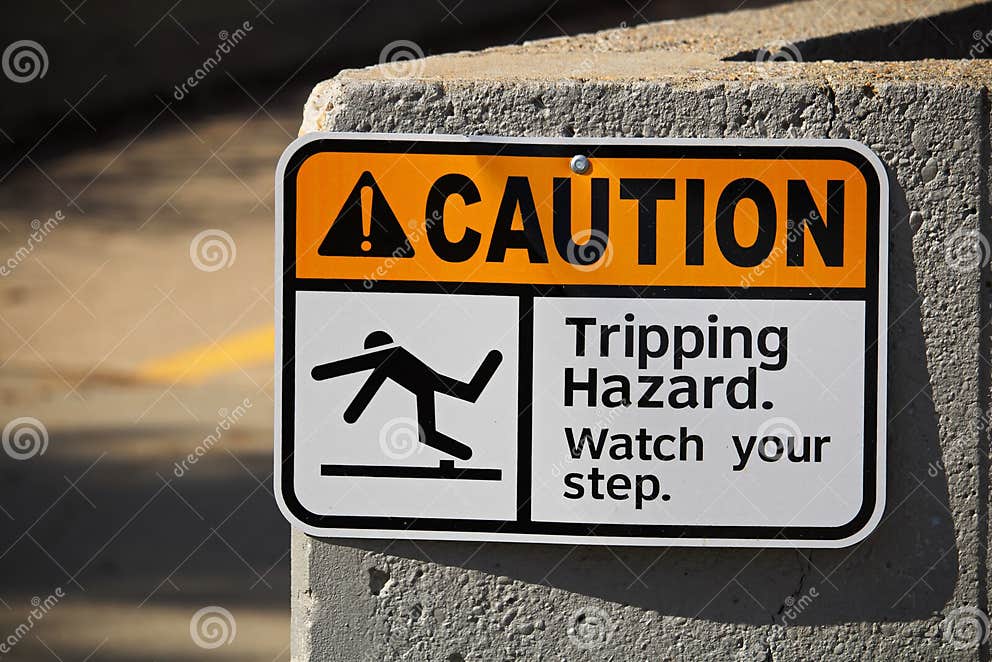 Caution Tripping Hazard Sign on a Wall Stock Photo - Image of path ...