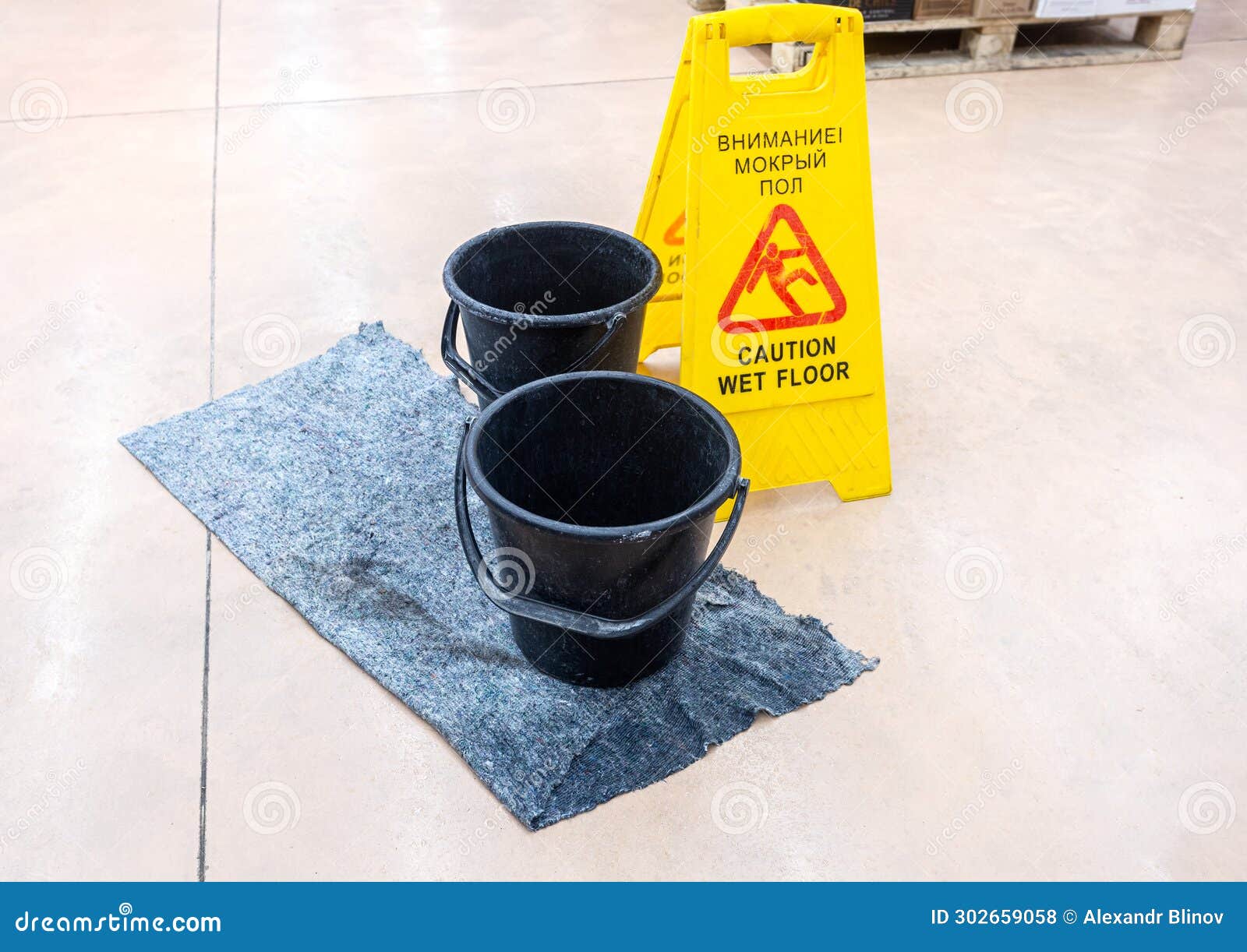 Caution Wet Floor Warning Sign on a Tile Floor in a Superstore Stock ...