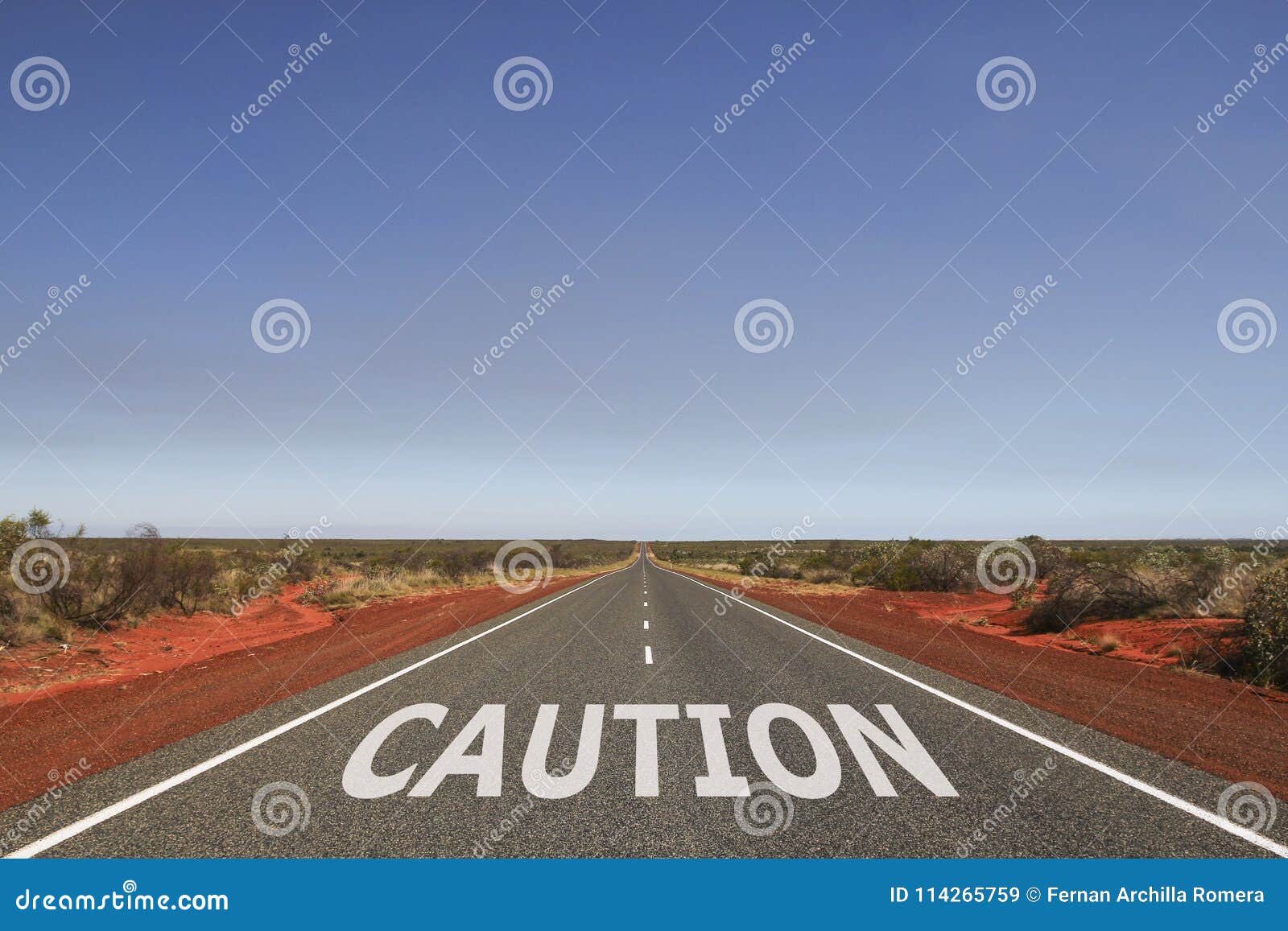 Caution Written on the Road Stock Image - Image of line, road: 114265759