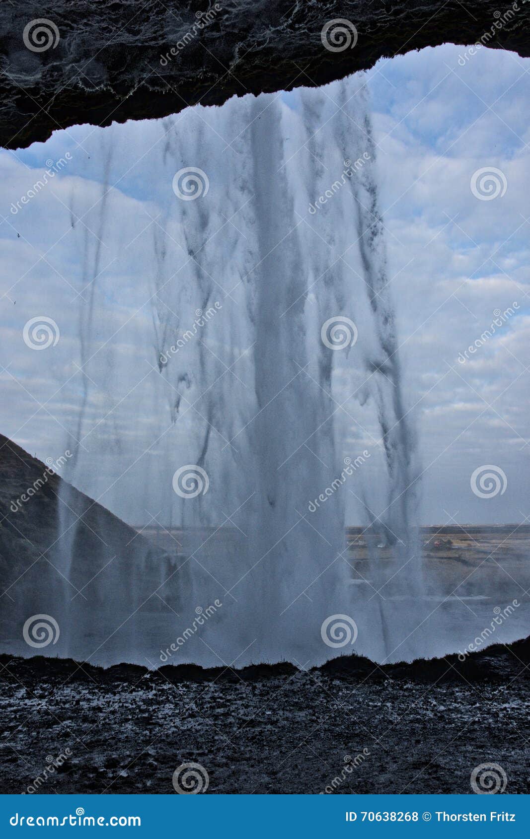Cave behind waterfall stock photo. Image of blue, water - 70638268