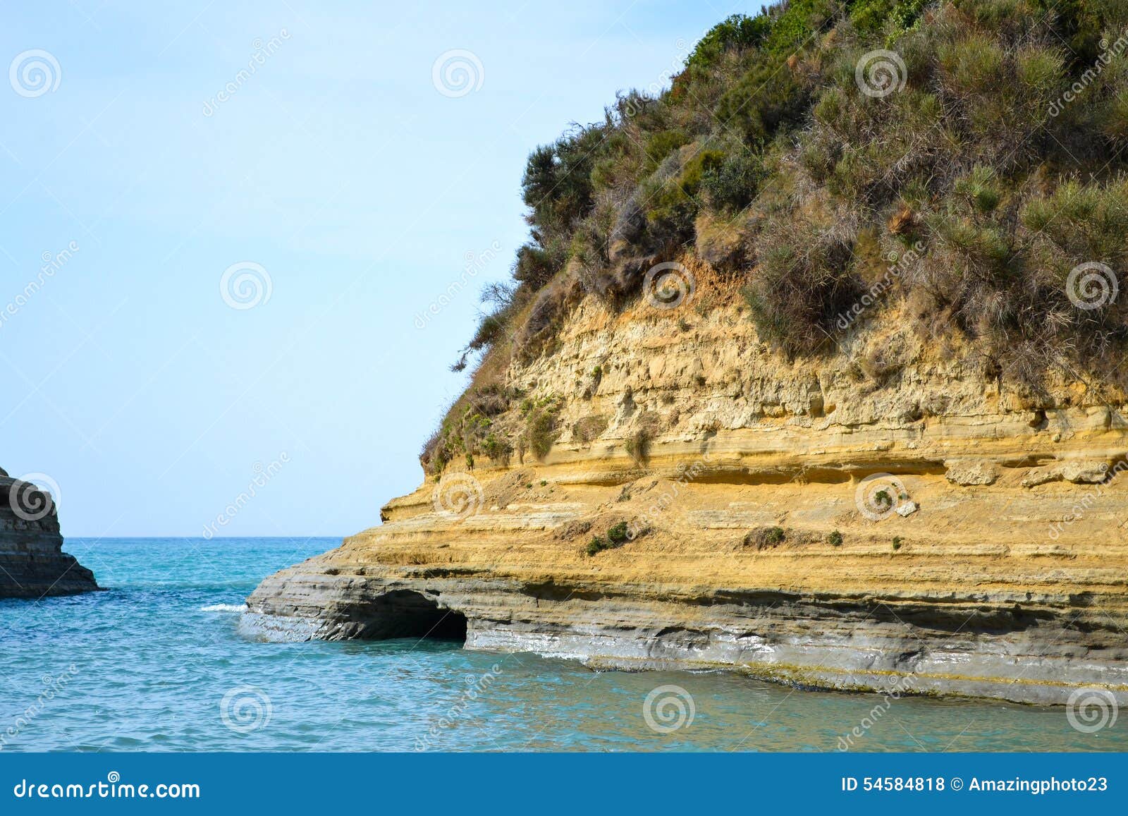 A cave below high cliffs stock photo. Image of coastal - 54584818