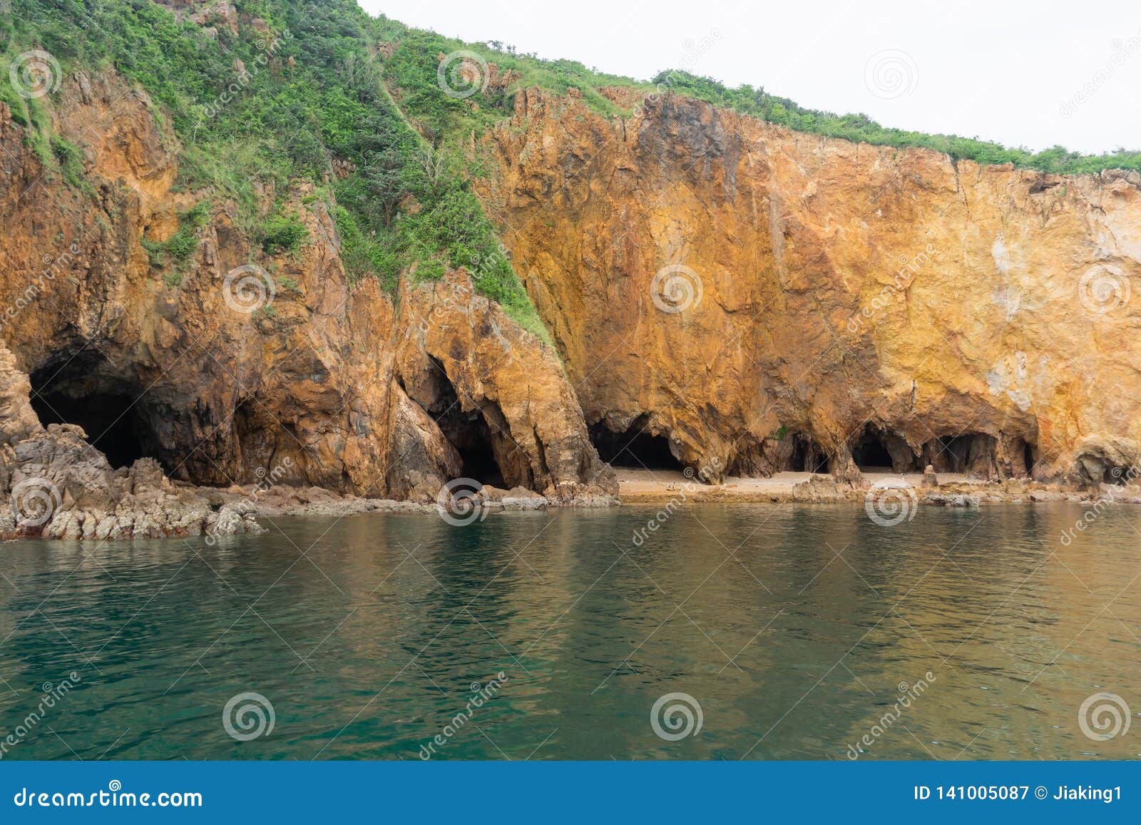 Cave on Cliff Island and Sea Stock Image - Image of exotic, tourism ...