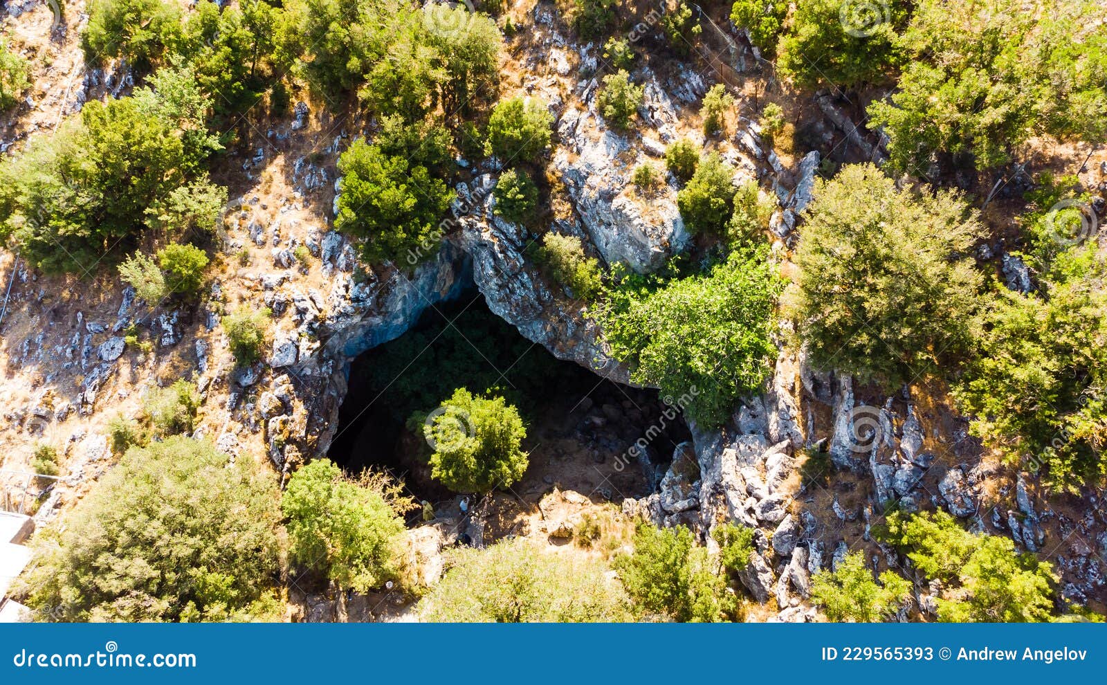 Cave entrance in the rock stock image. Image of tunnel - 229565393