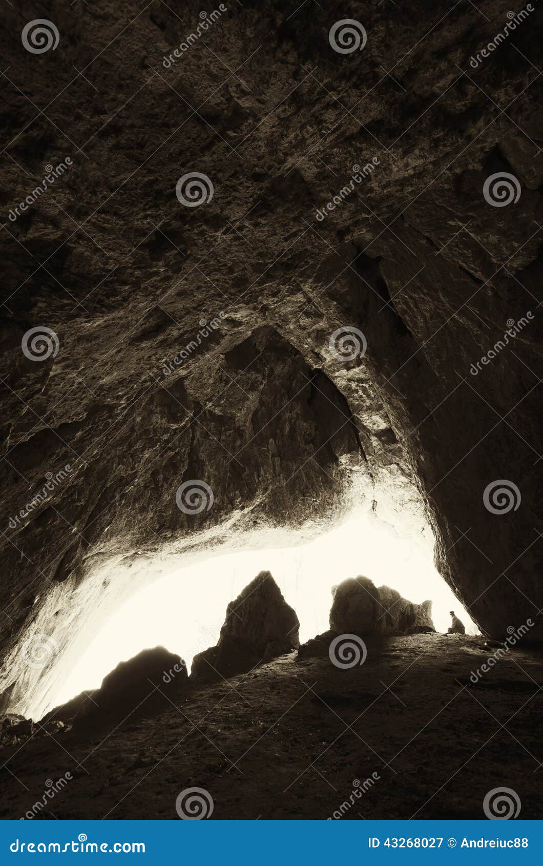 Cave Entrance with Silhouette of Man Standing Stock Image - Image of ...
