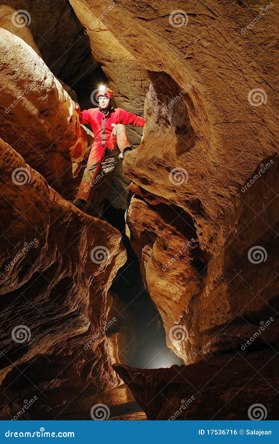 The Cave Explorer Looks At The Icy Stalagmite Royalty-Free Stock ...