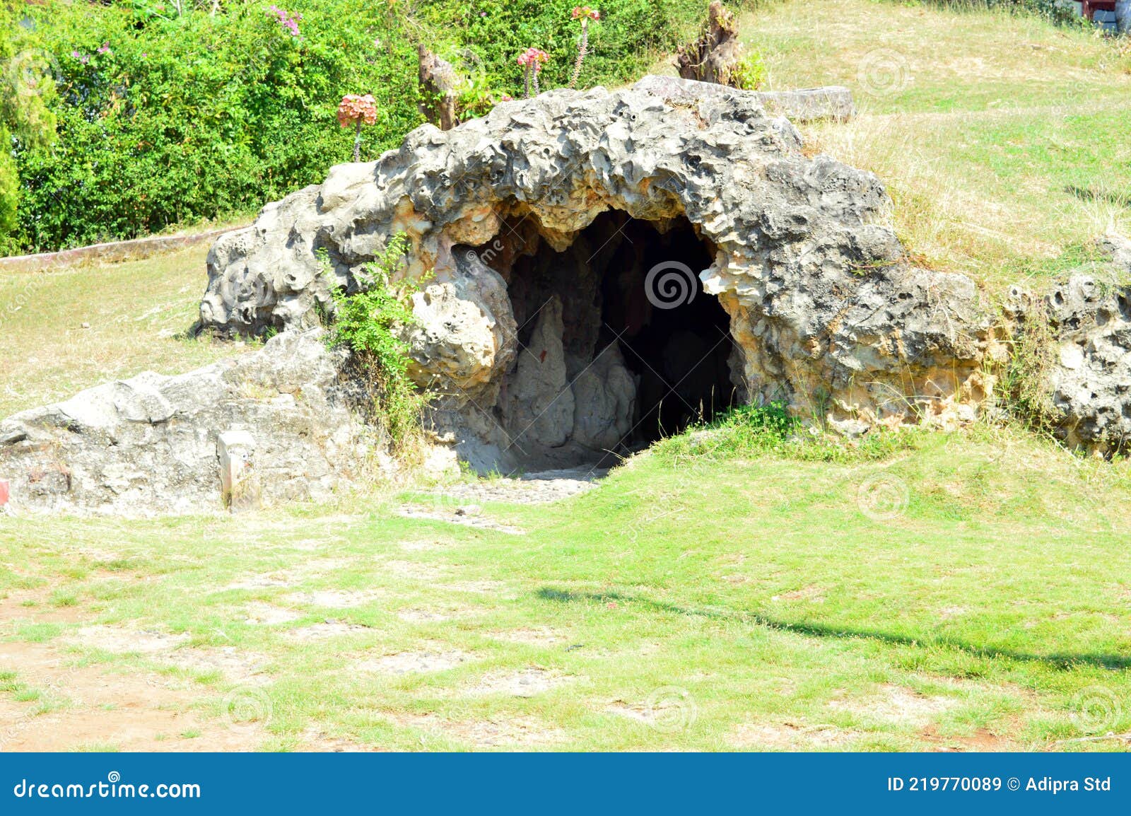 Cave on the grass hill stock image. Image of adventure - 219770089