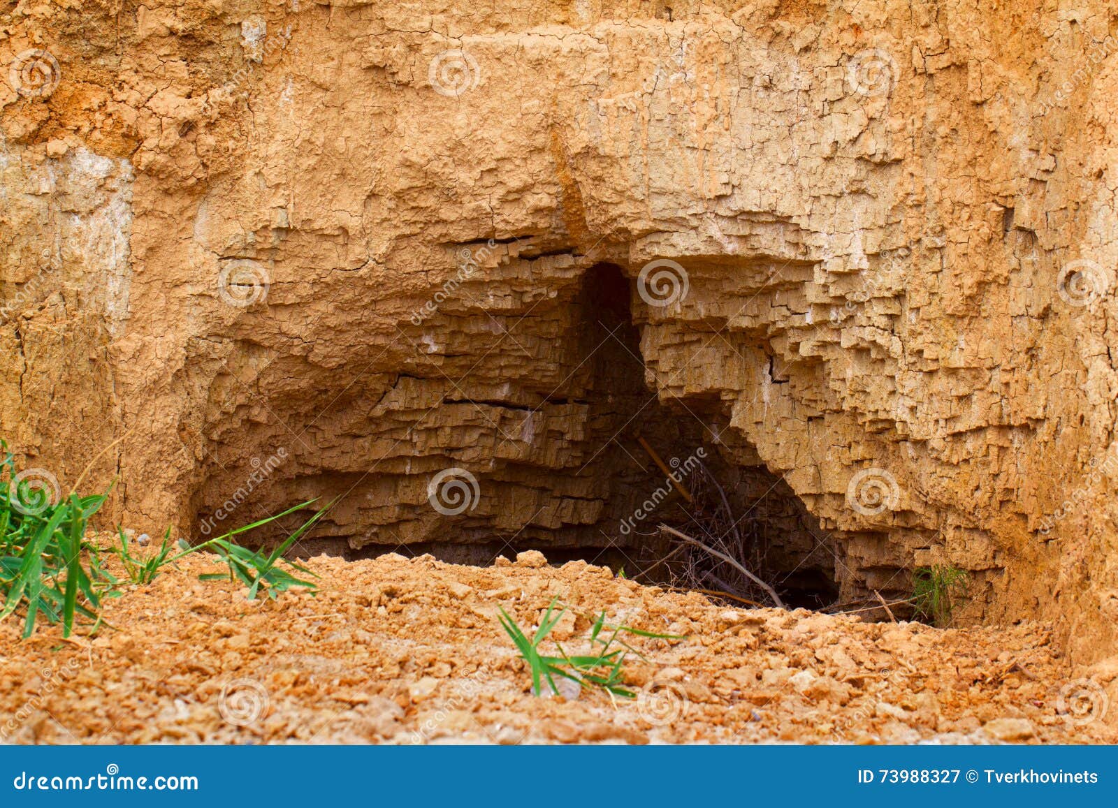 A cave in the hill stock image. Image of archeology, soil - 73988327