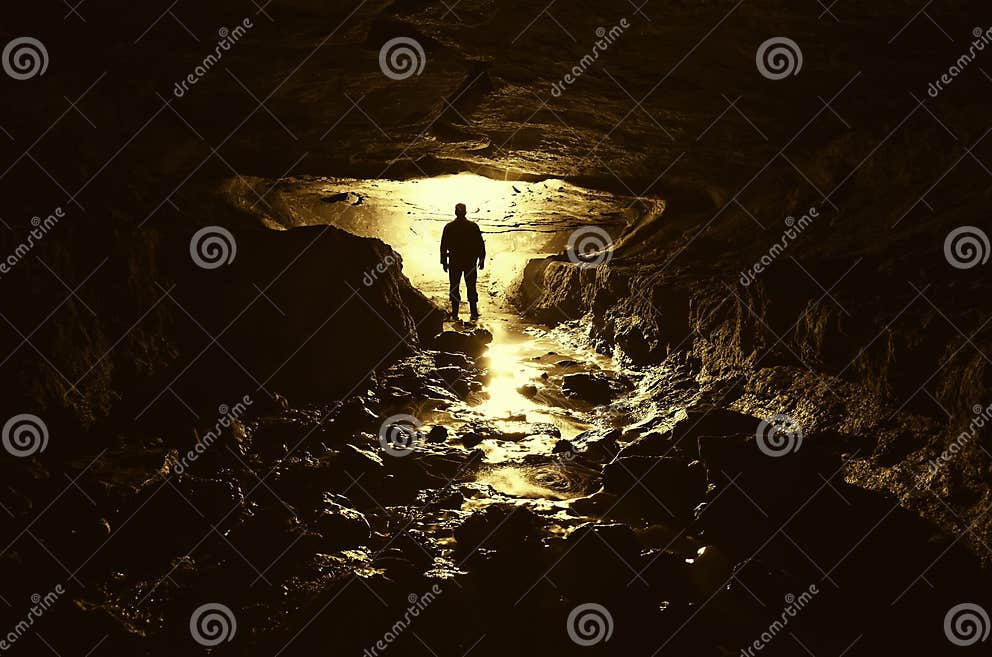 Cave with Man Silhouette and Water Stock Image - Image of earth ...
