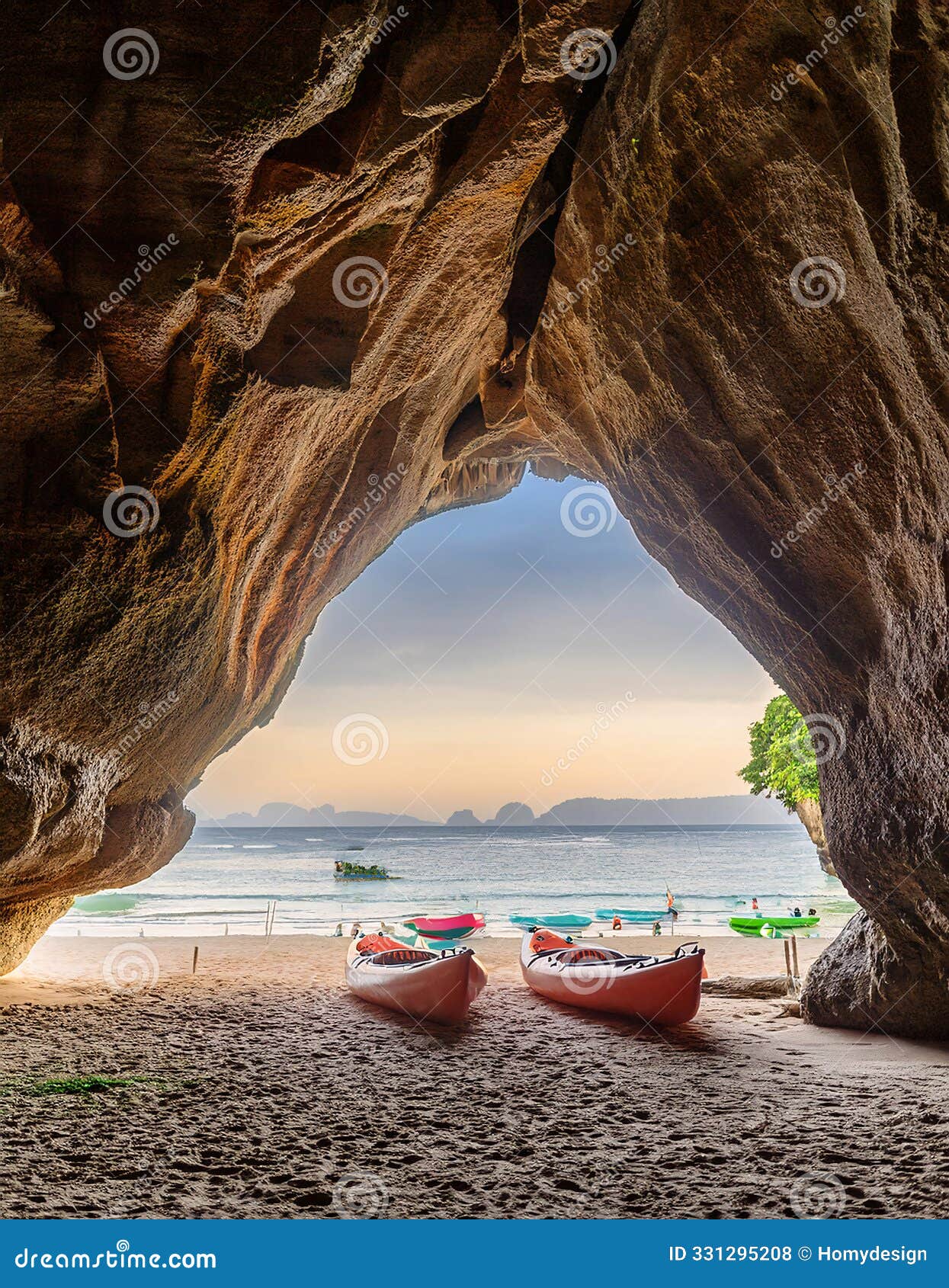 Cave Opening Framing a Serene Beach View with Kayaks and Clear Sky ...