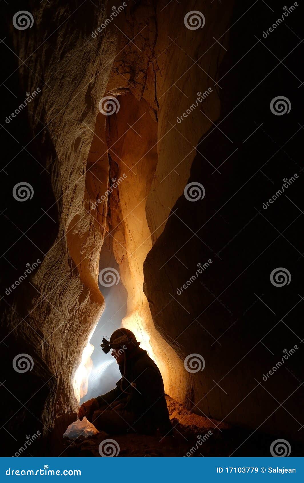 Cave passage with a caver stock image. Image of caving - 17103779