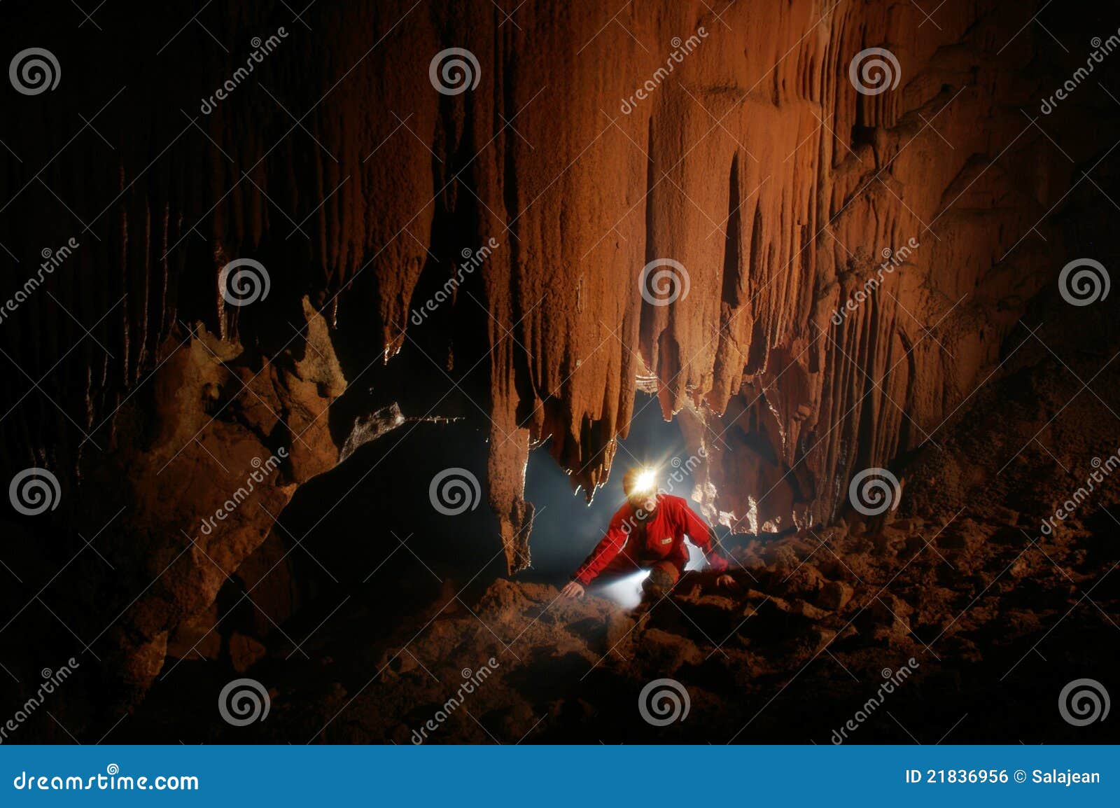 Cave passage with a caver stock photo. Image of attraction - 21836956