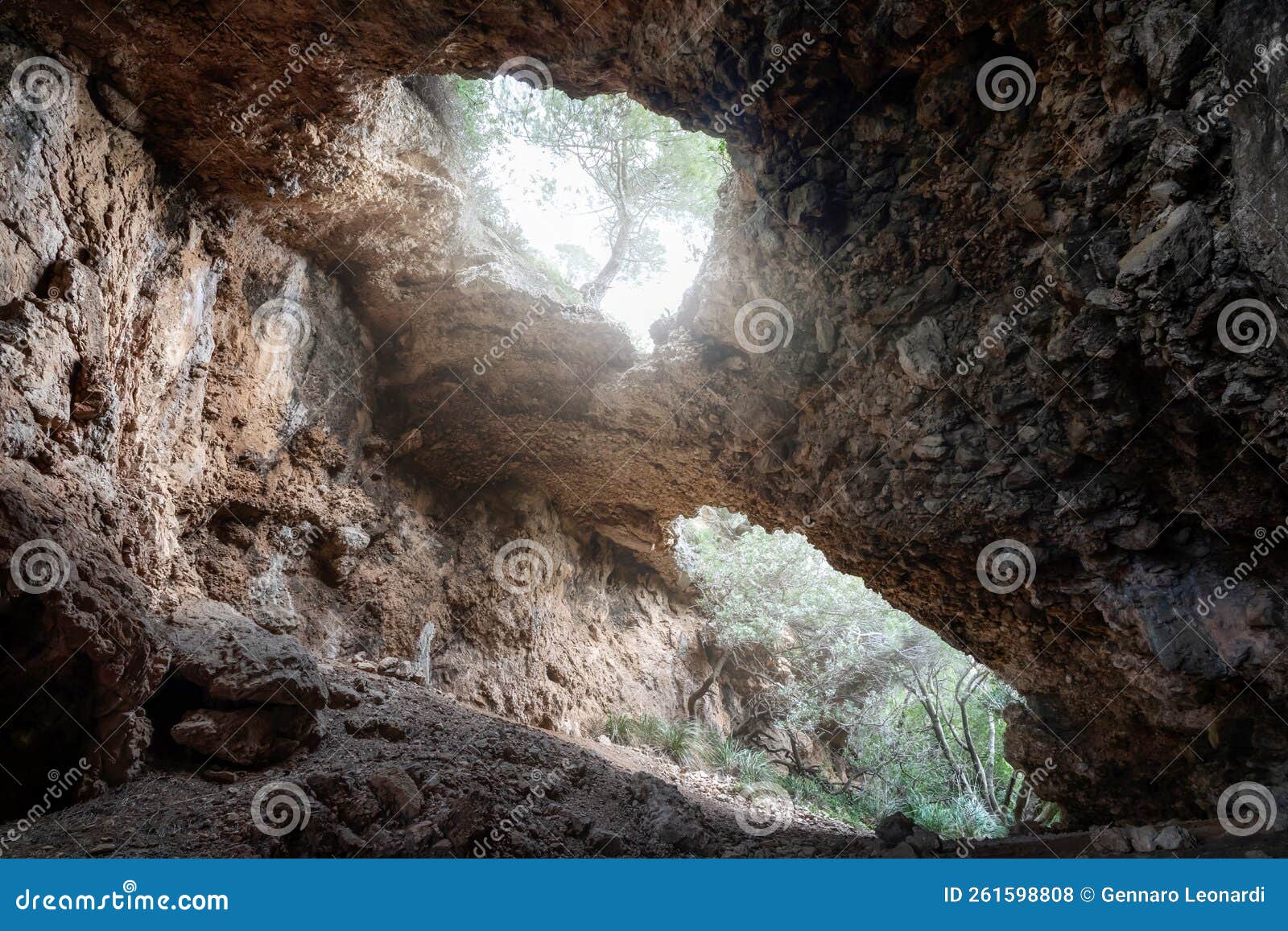 Cave of rocks on the path. stock photo. Image of ancient - 261598808