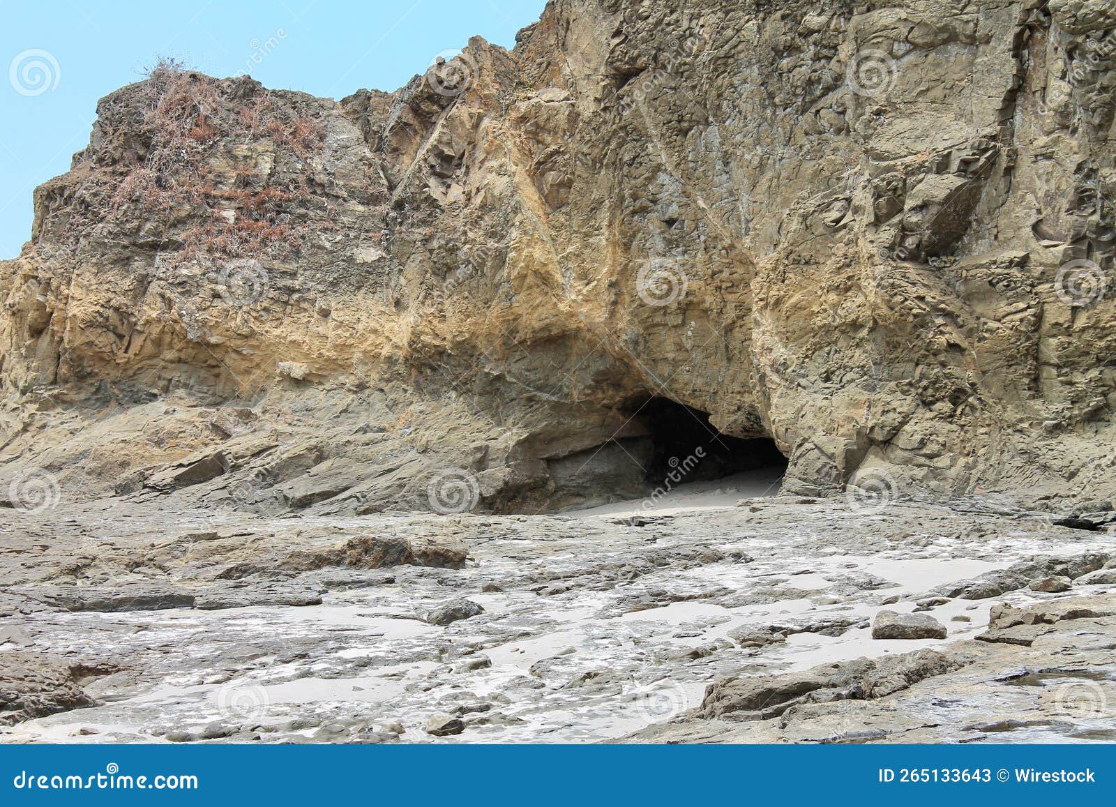 Cave at a rocky seaside stock image. Image of exterior - 265133643