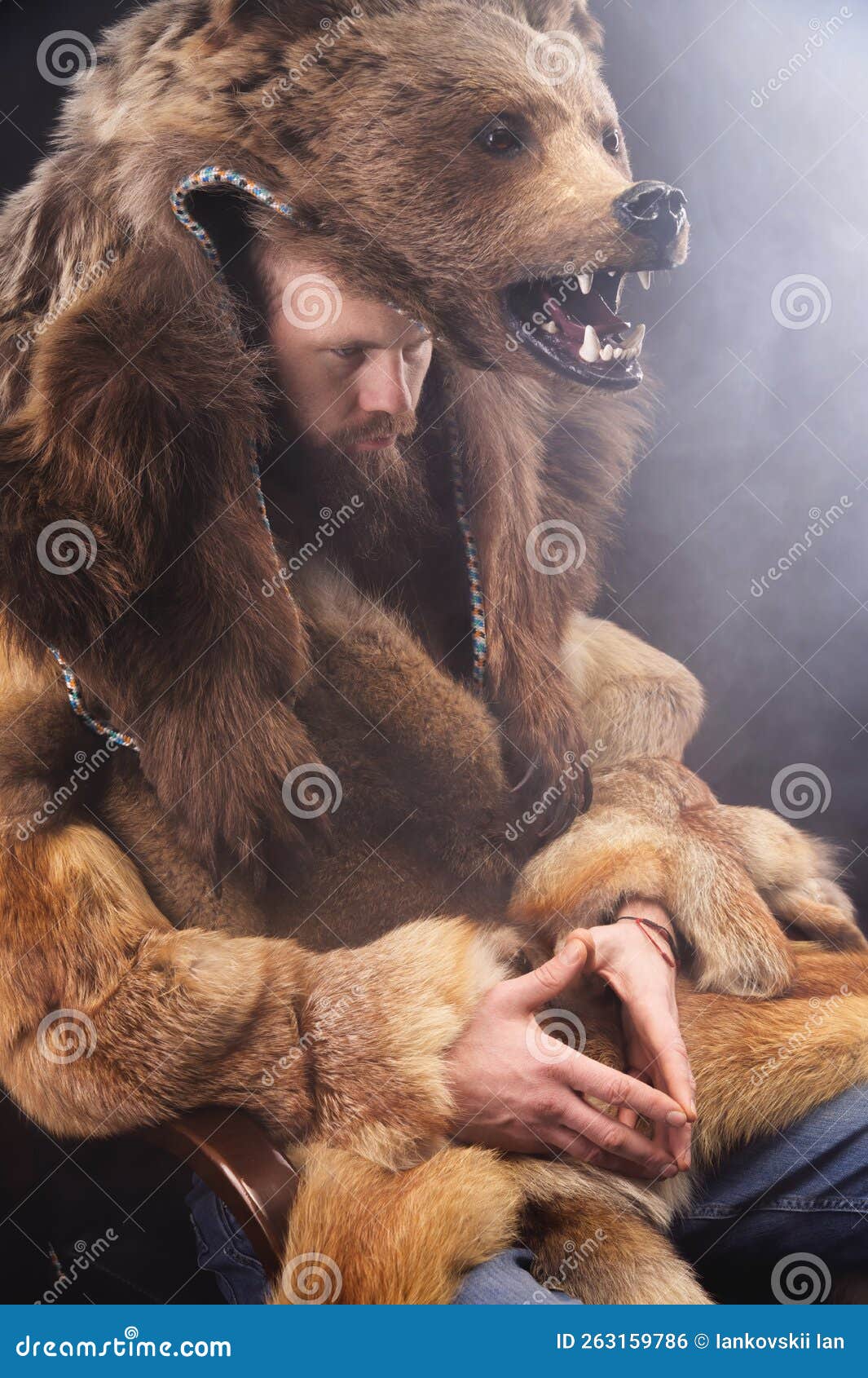 Caveman in Bearskin, Serious Bearded Man, Medieval Cosplay Stock Photo ...