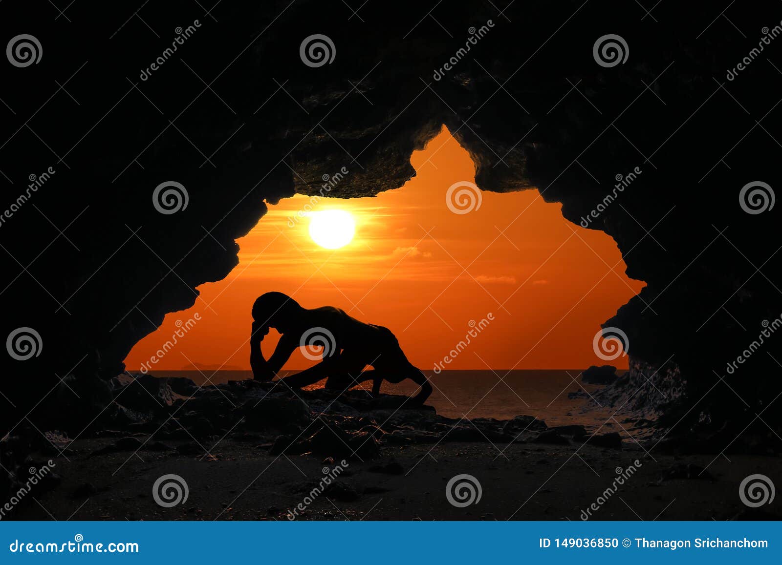 Caveman Posture or Action in the Cave at Red Sky Sunset Stock Photo ...