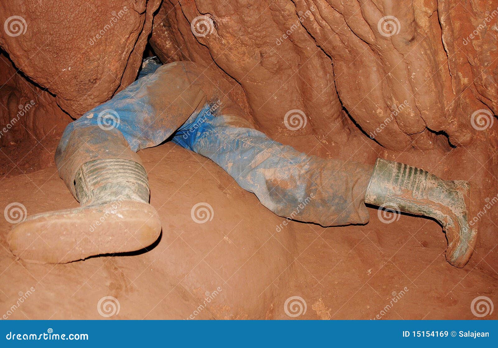 Caver in a narrow passage stock image. Image of climb - 15154169