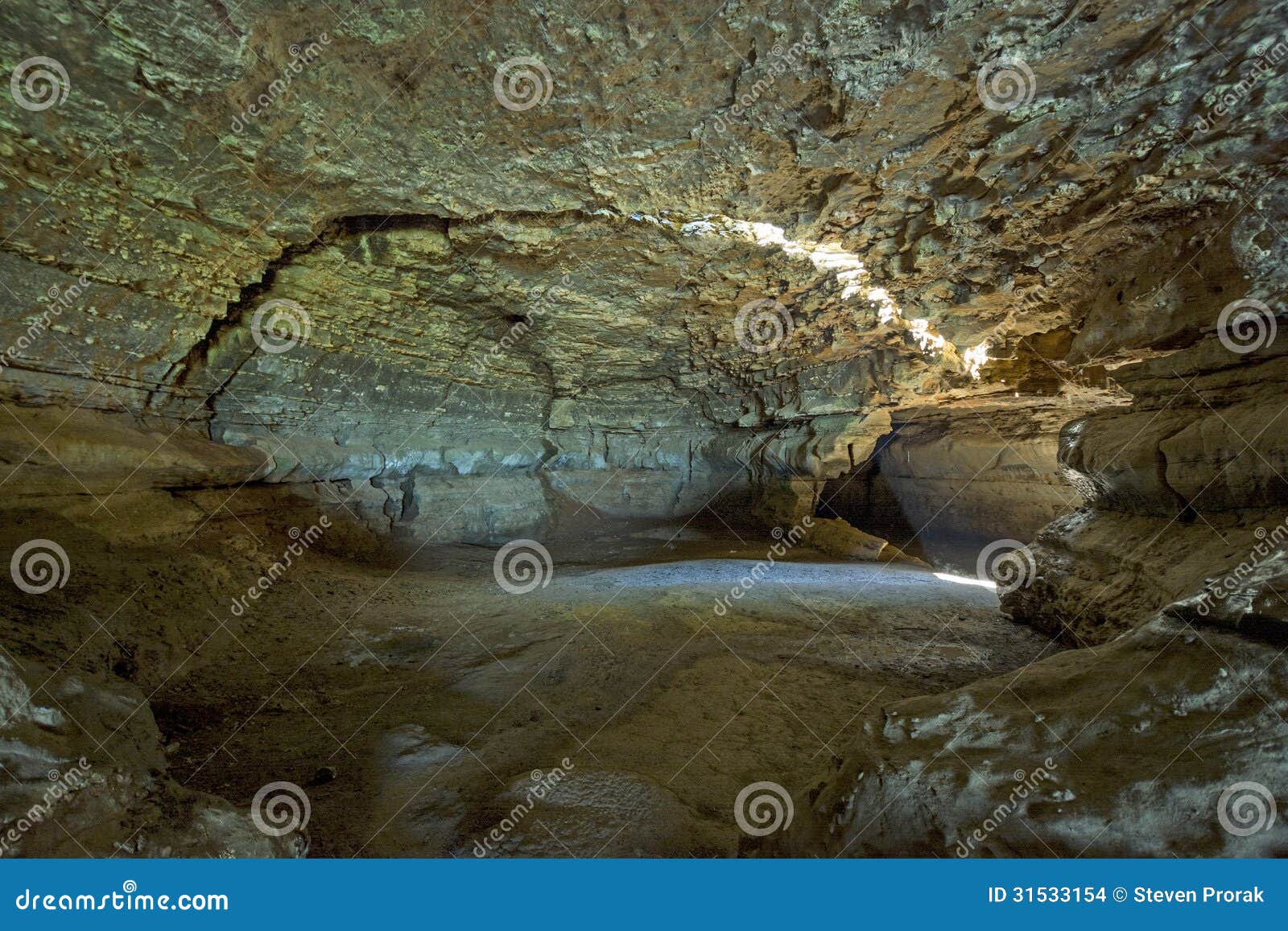 Cavern with Natural Light from Overhead Crack Stock Photo - Image of ...