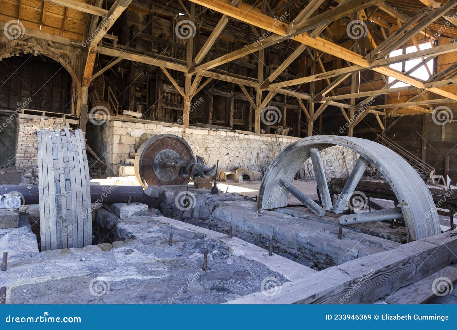 Cavernous Wooden Building with Large Metal Wheels for Ore Processing ...