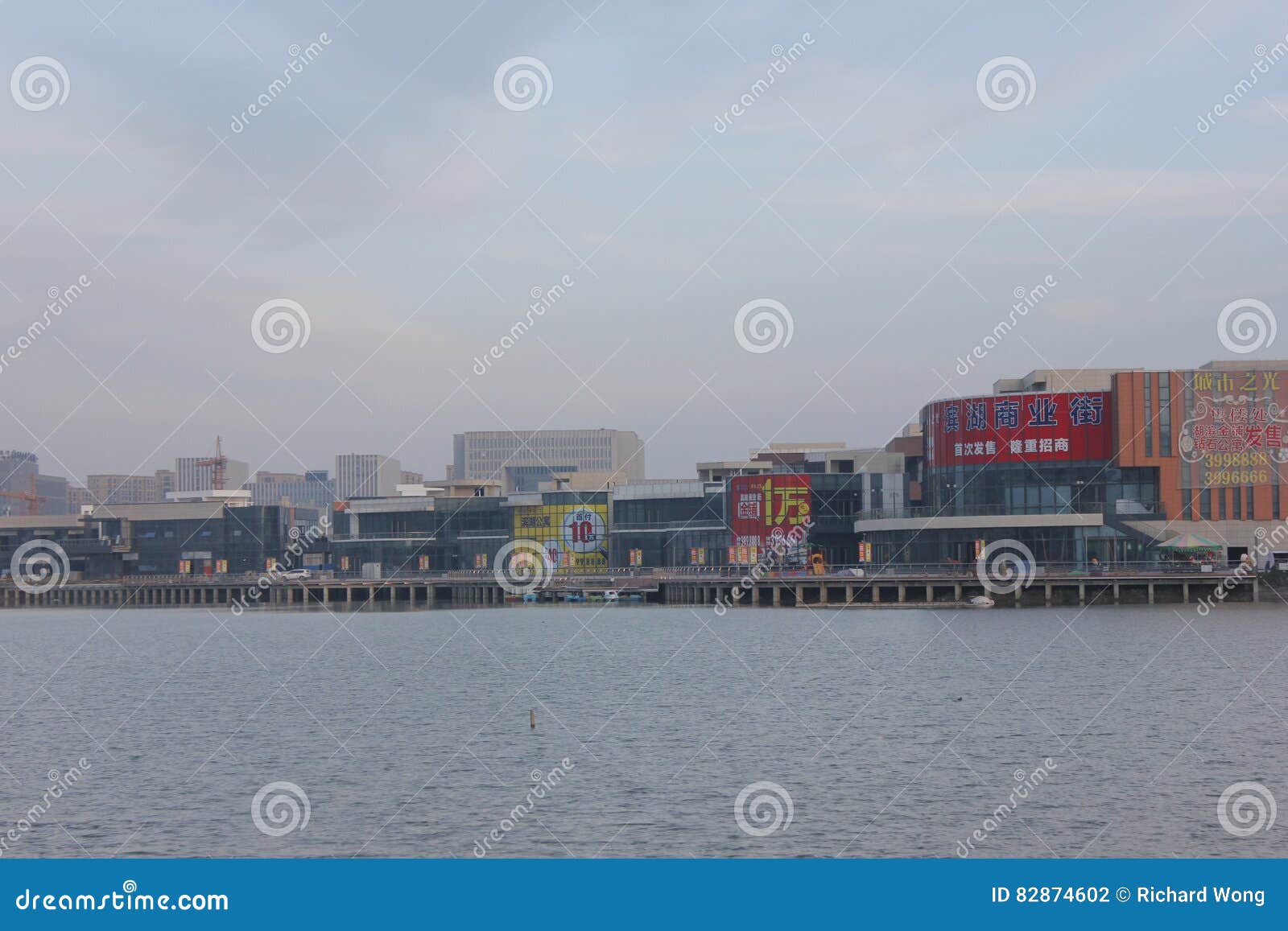 CBD Buildings Around the Lake with Advertisement Editorial Photography ...