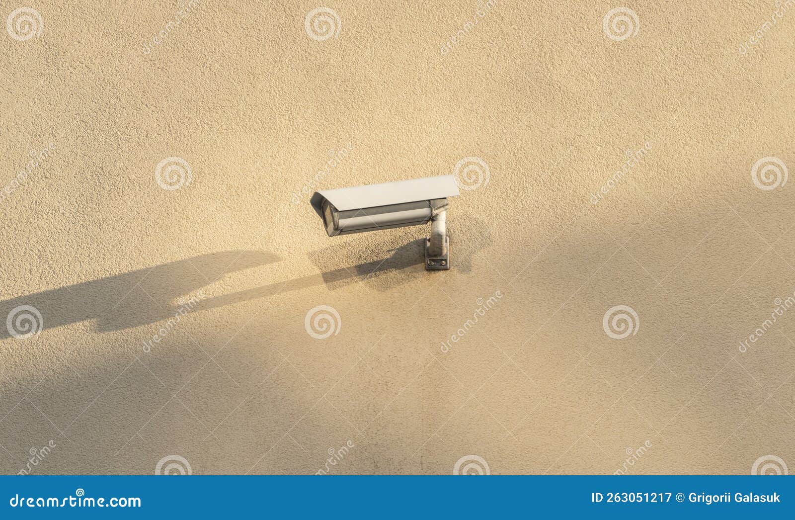 A CCTV Camera Hangs on the Corner of a Beige Building Stock Image ...