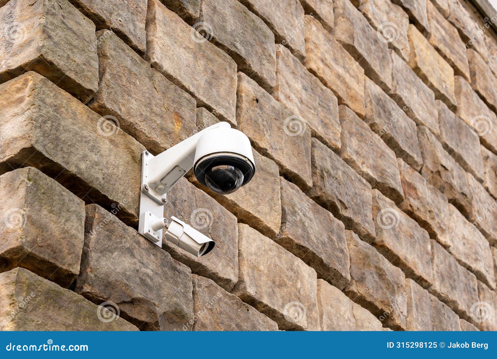 A CCTV Camera is Installed on a Stone Wall. Stock Image - Image of ...