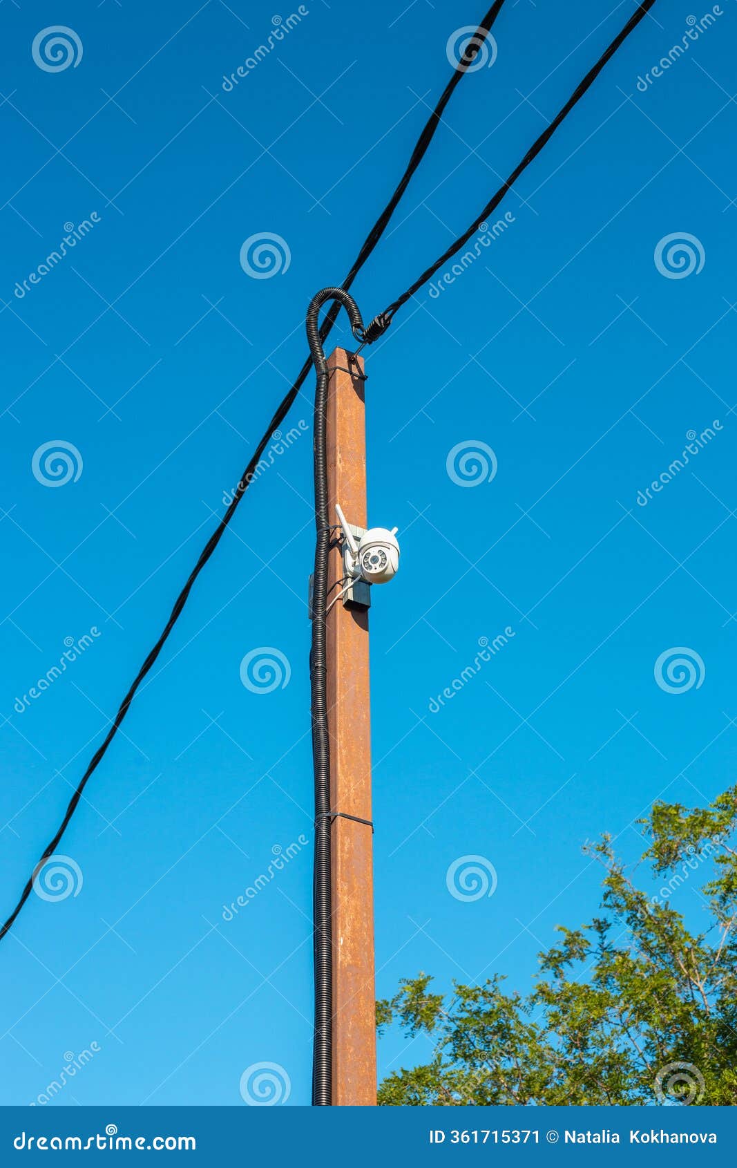 CCTV Camera on a Pole with Electric Wires. Security and Surveillance of ...