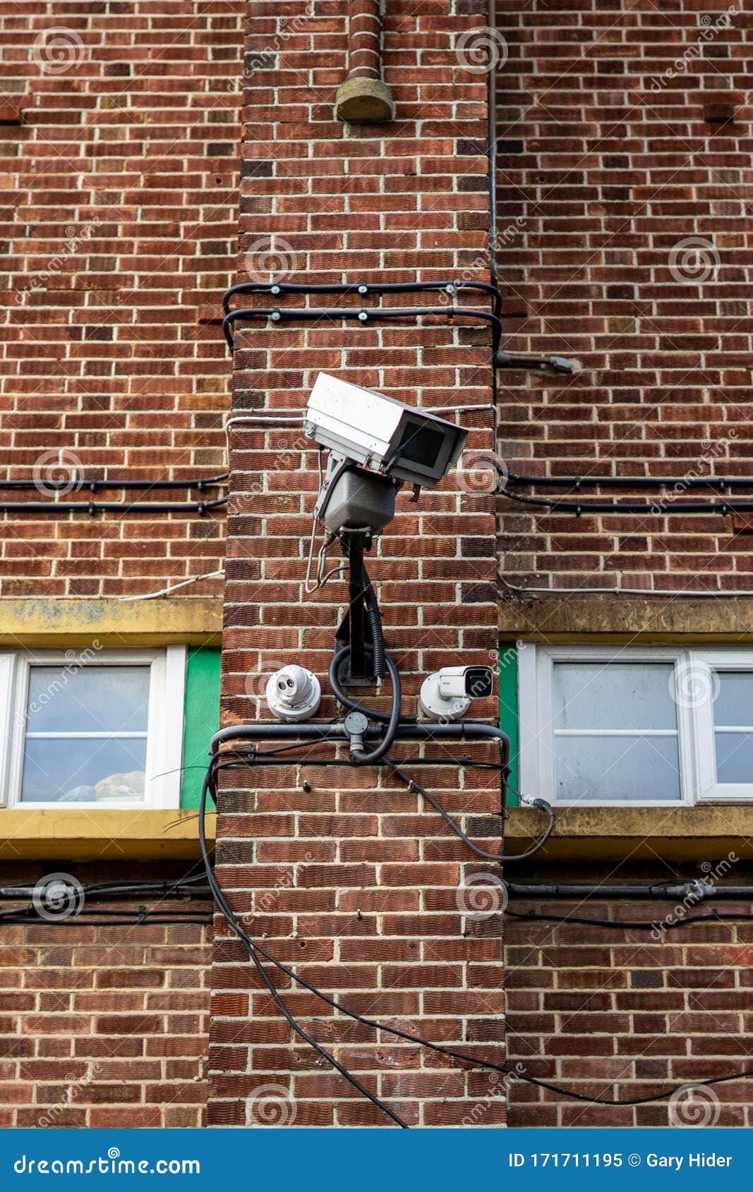 A CCTV Camera on the Side of a Brick Building Stock Image - Image of ...