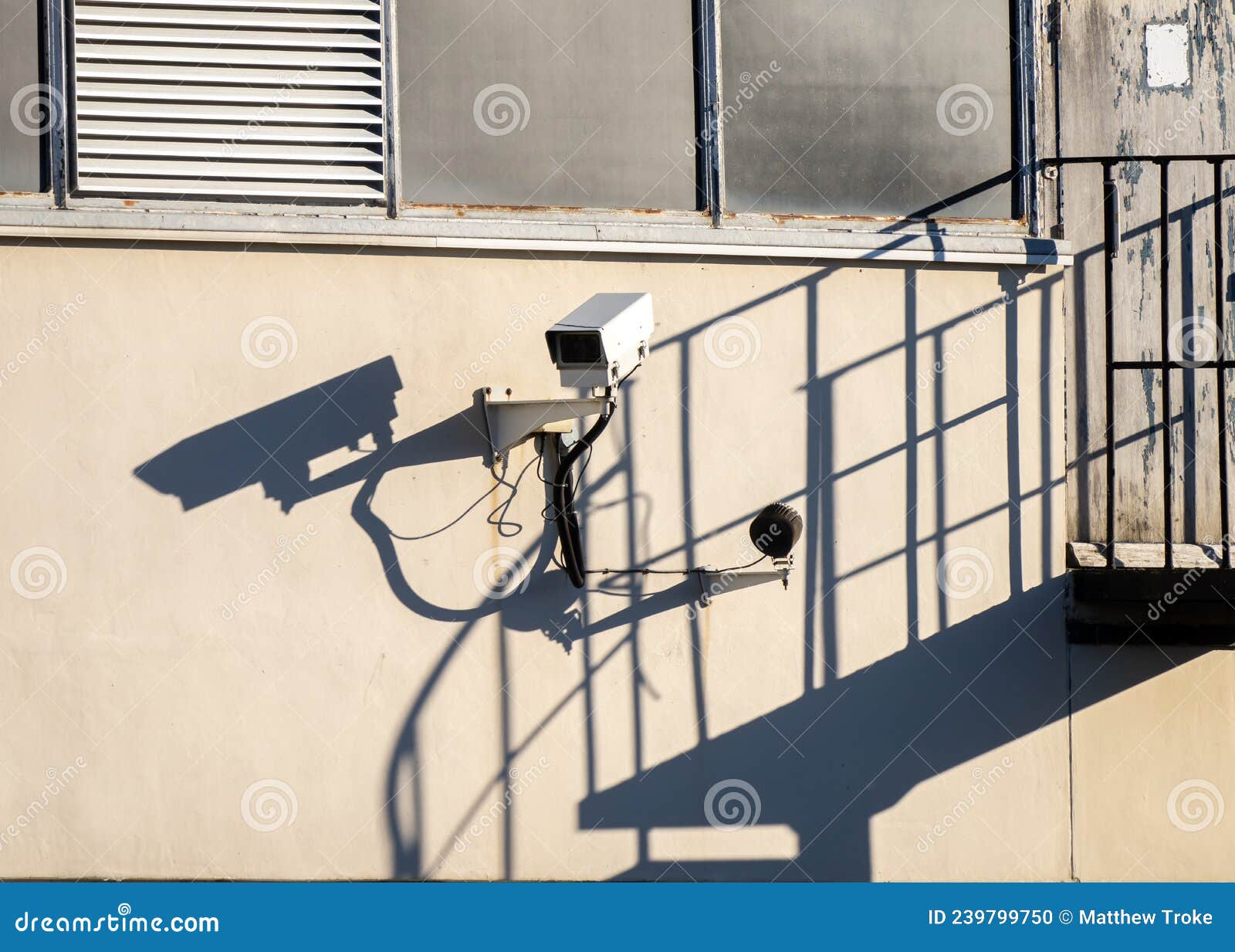 CCTV Professional Camera Looking Out with Shadow Cast on Building Wall ...