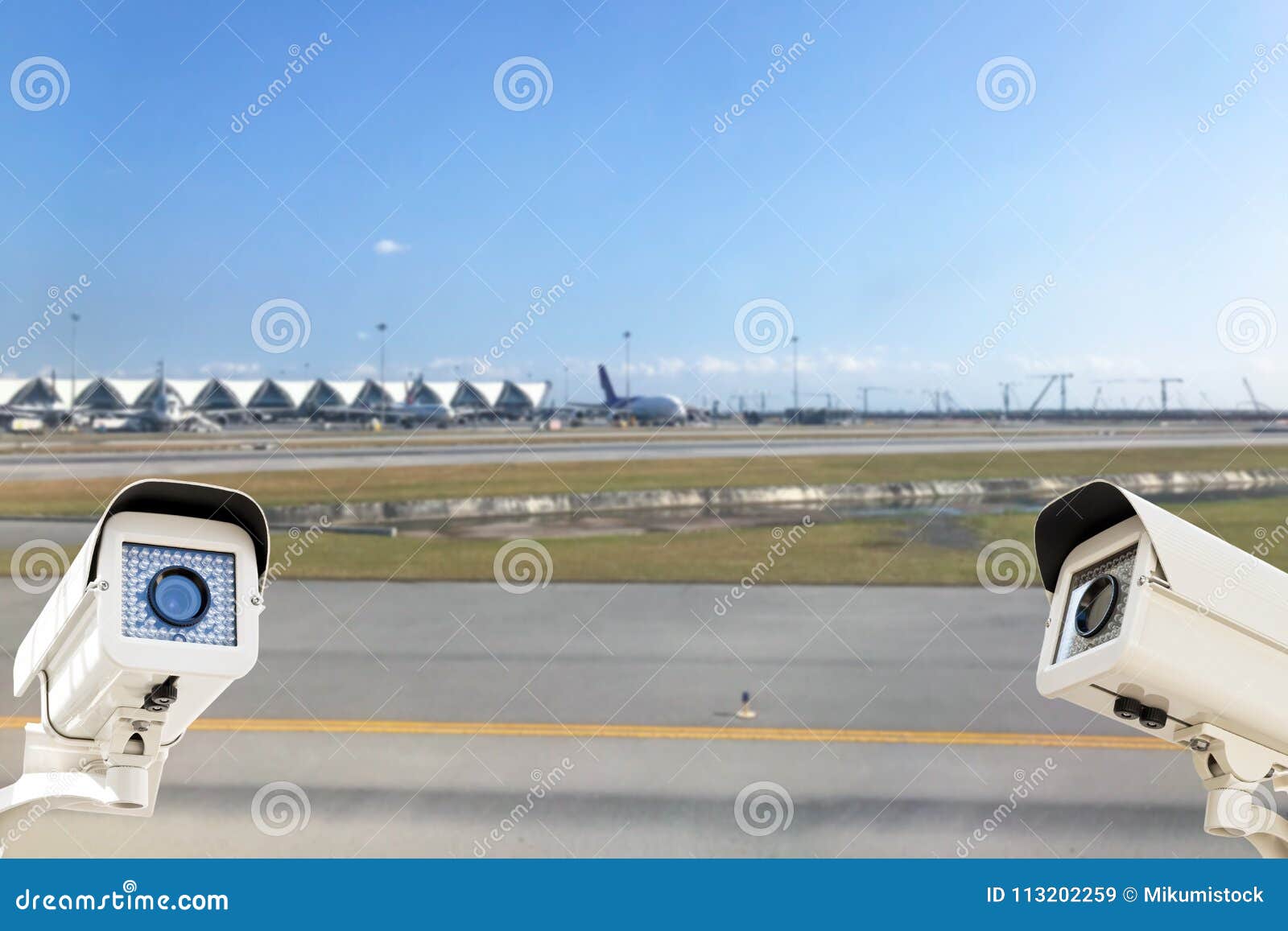 CCTV Security Camera Operating in Airport Runway Background. Stock ... CCTV Security Camera Operating in Airport Runway Background. Stock ...