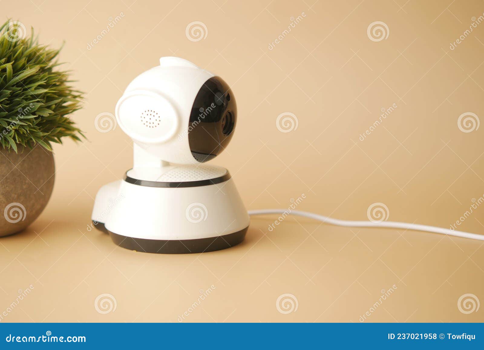 CCTV Security Camera Operating on Light Orange Background Stock Photo ...