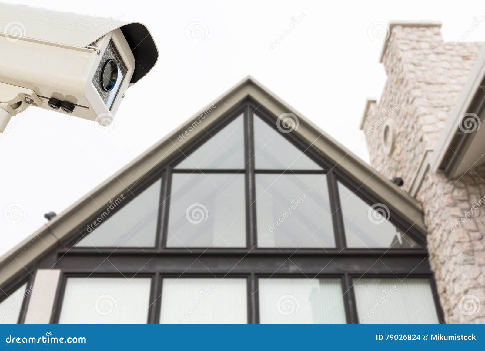 The CCTV Security Camera Operating On Luxury Roof House Blur Background ...